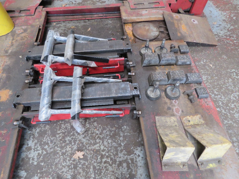 A four post 4-ton MOT ramp with internal swivel plates and two jacking ...
