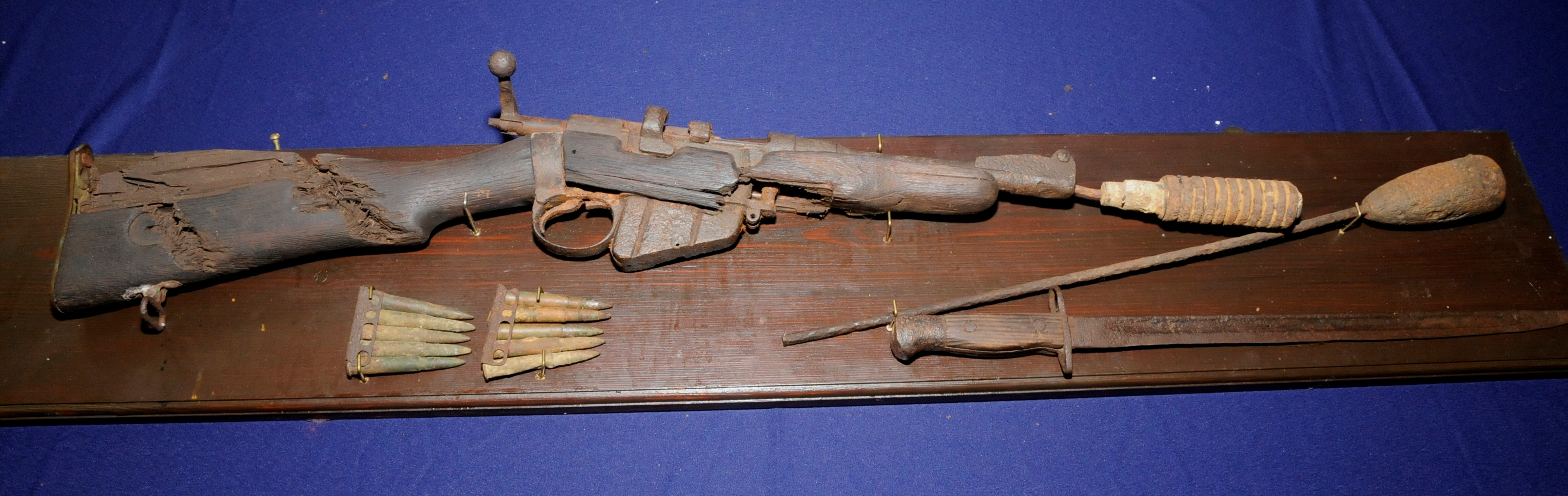 Relic British Lee Enfield rifle mounted on a board with bayonet and two ...