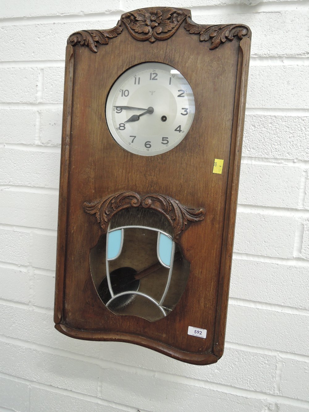 A 1920/1930s (pre war) Art Deco style oak cased wall clock having deco ...