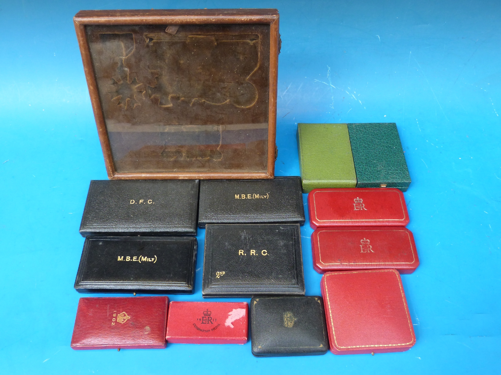 A collection of original prestigious medal boxes including DFC, MBE x 2 ...