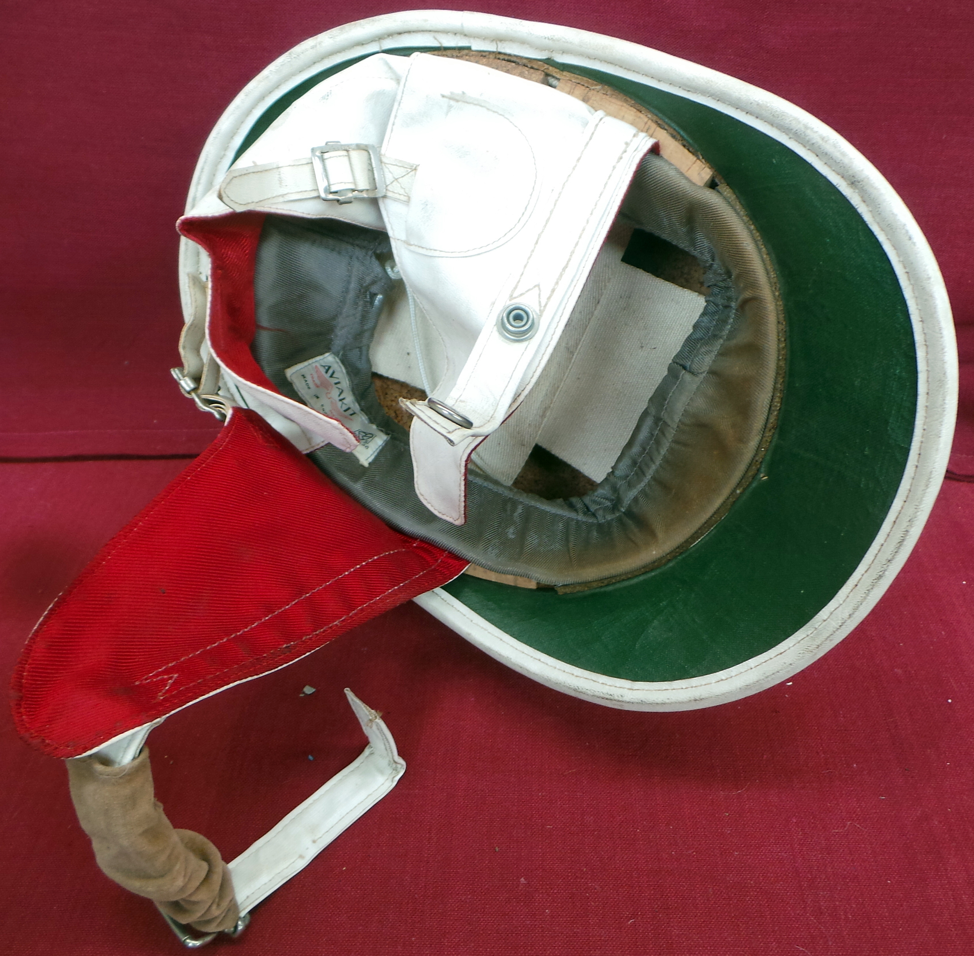 Two vintage motorcycle helmets. A circa 1960s cream 'Aviakit' helmet ...