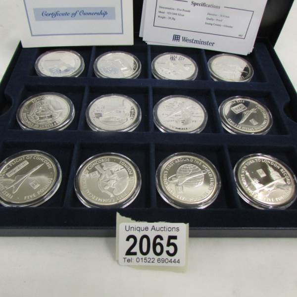 A cased 'Concorde Milestones' mint set coin collection of 12 silver £5 ...