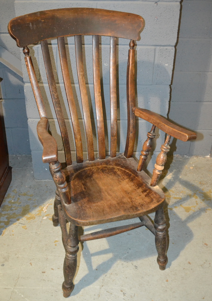A Victorian beech lath back chair on turned splayed baluster legs ...