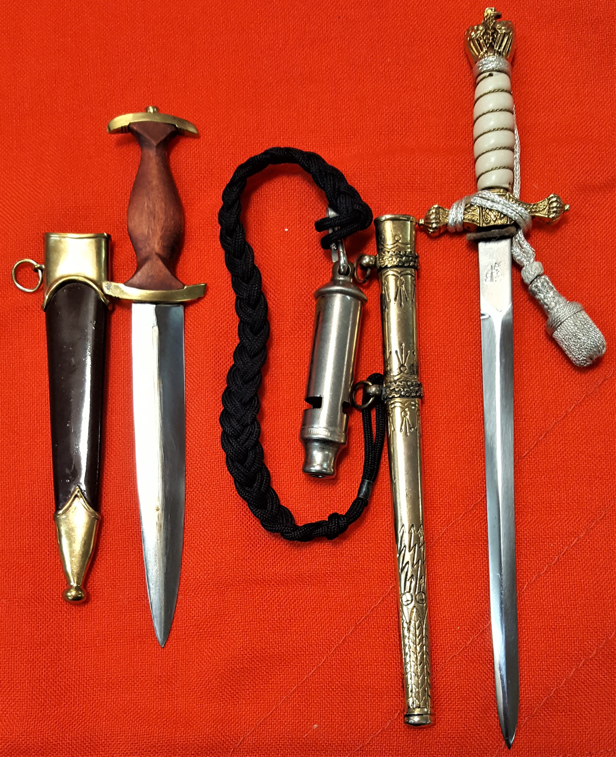 Lot of WW2 German replica miniature daggers & insignia (5). Includes SA ...