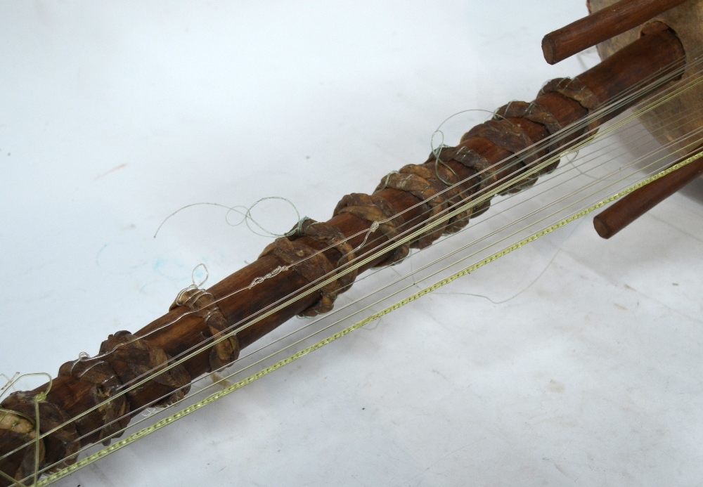 An African tribal Kora (stringed instrument), from Guinea Bissau, the ...