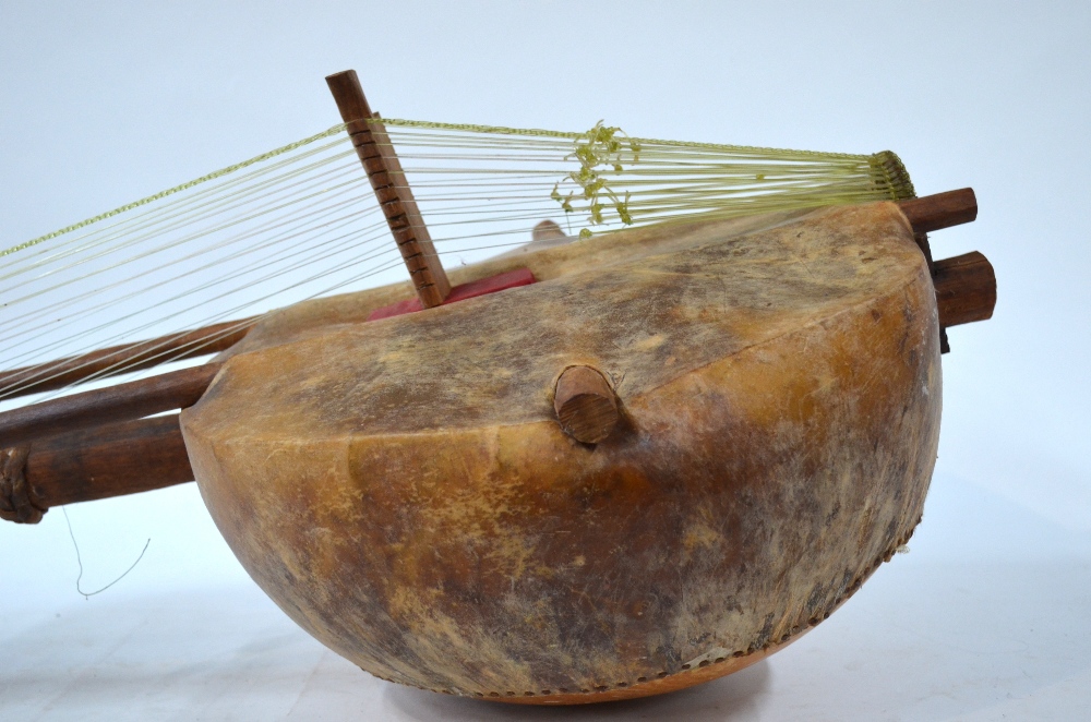 An African tribal Kora (stringed instrument), from Guinea Bissau, the ...