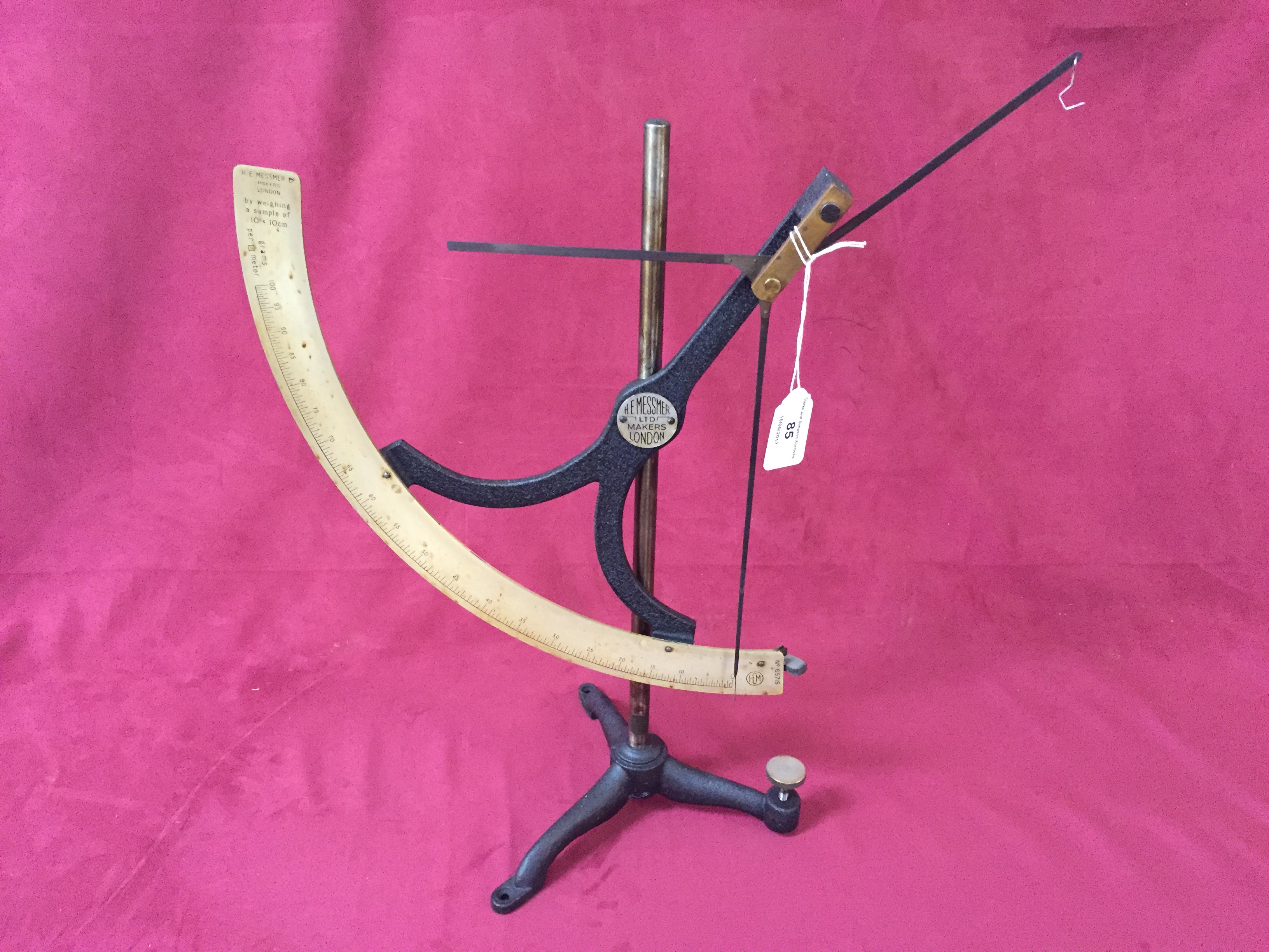 A set of paper weighing scales and calculator by H.E. Messemer of London