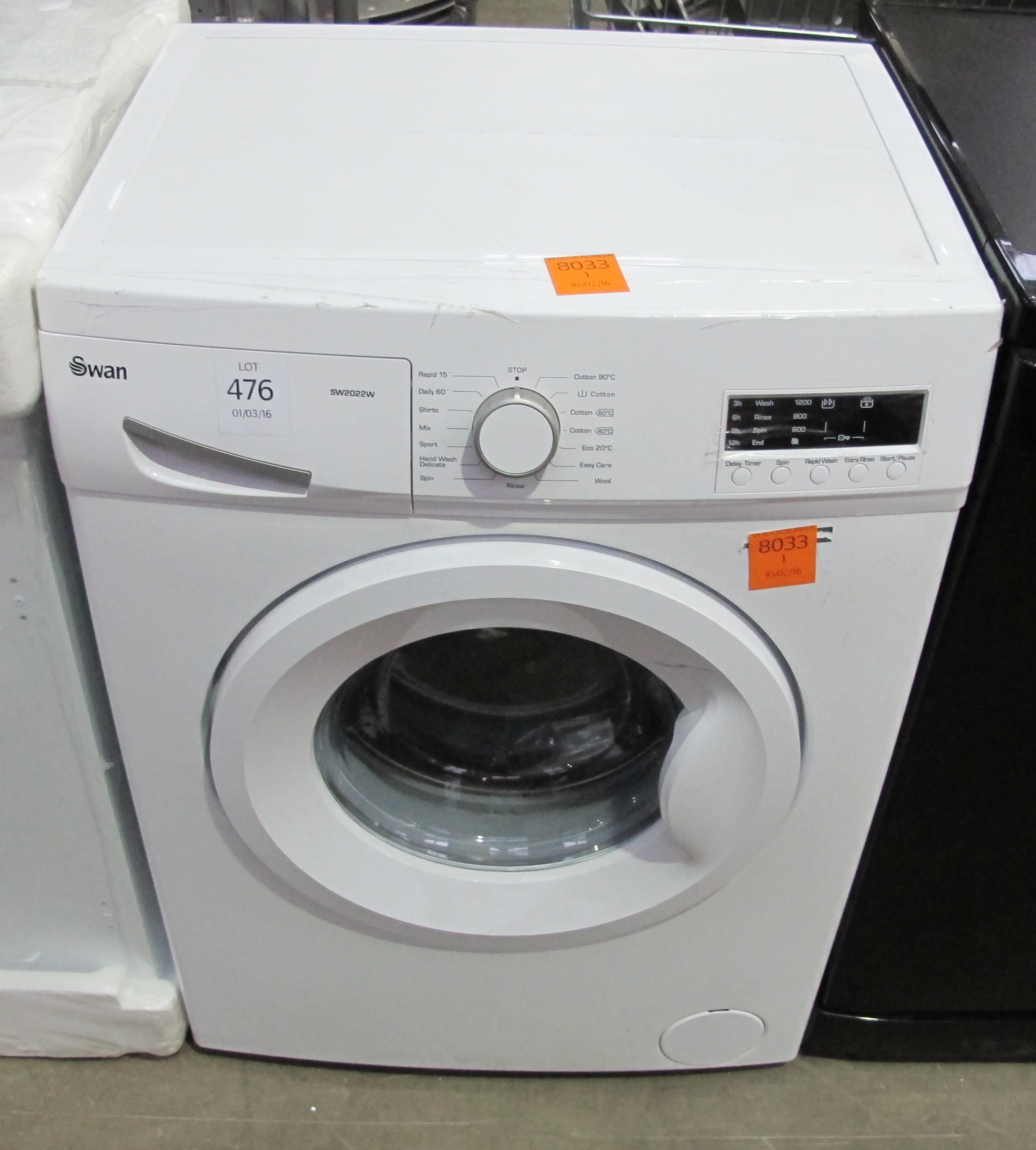 A Swan SW2022W Washing Machine, new with side damage
