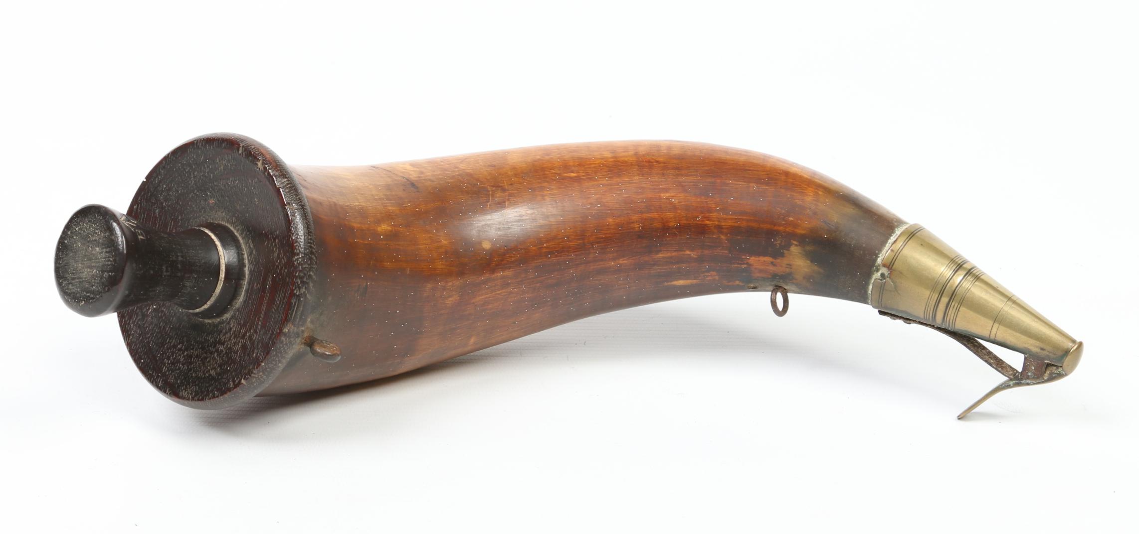 A 19th century horn powder flask with brass mounts. Broad arrow mark ...