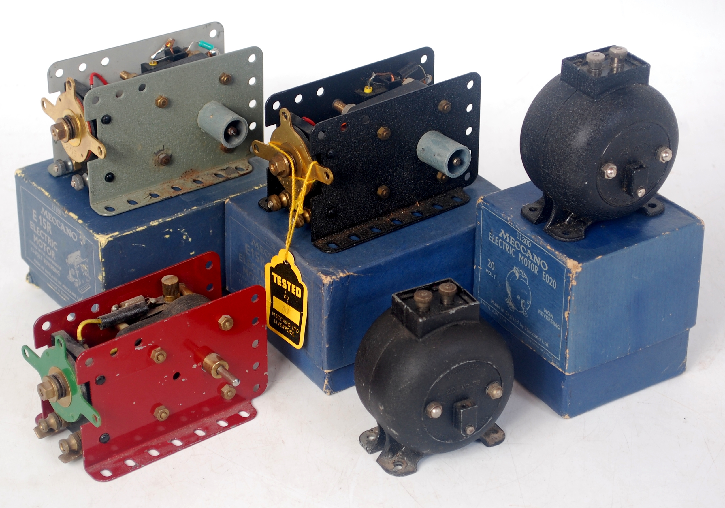 Five assorted Meccano electric motors to include; 1950s E15R electric ...