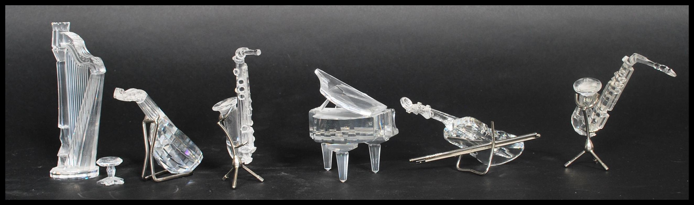 A group of six Swarovski faceted crystal glass musical instruments to ...