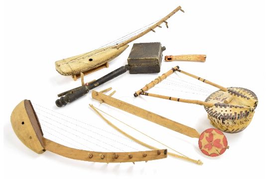 Group of African instruments, a long lute, probably north African, one ...