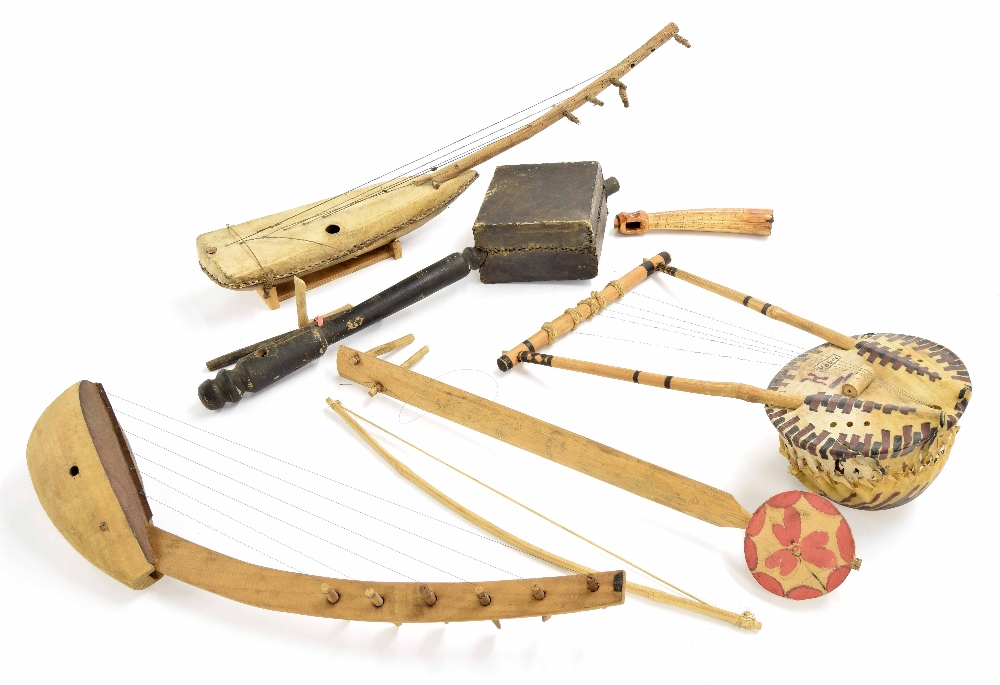 Group of African instruments, a long lute, probably north African, one ...