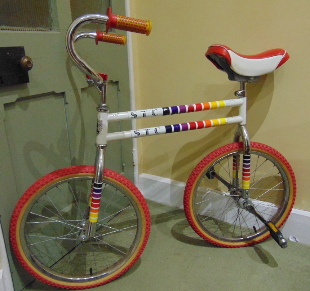 A 1970s/80s Super Trick Bike with red tyres, spinning handlebars and seat.