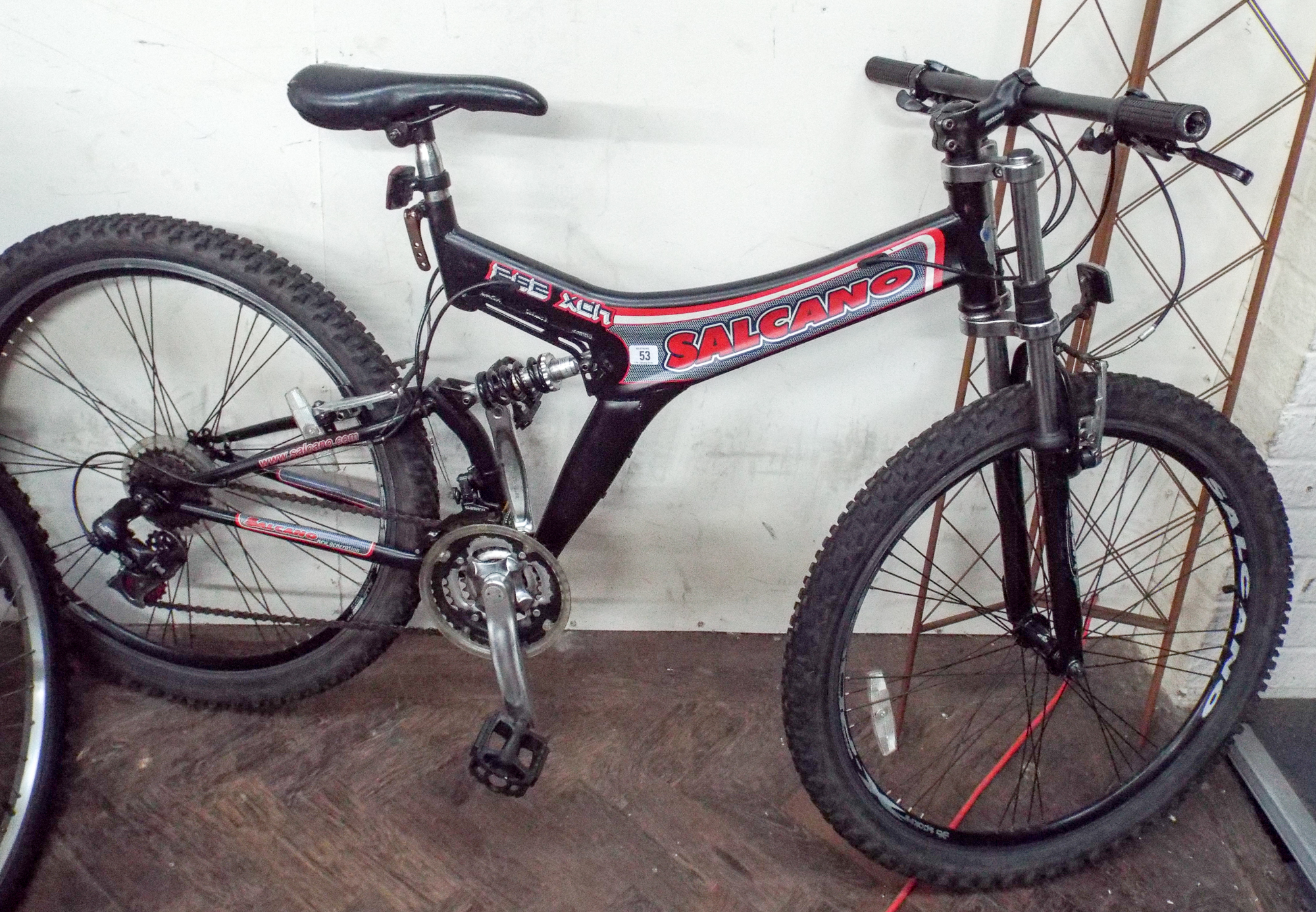 A Salcano black and silver mountain bike with full suspension