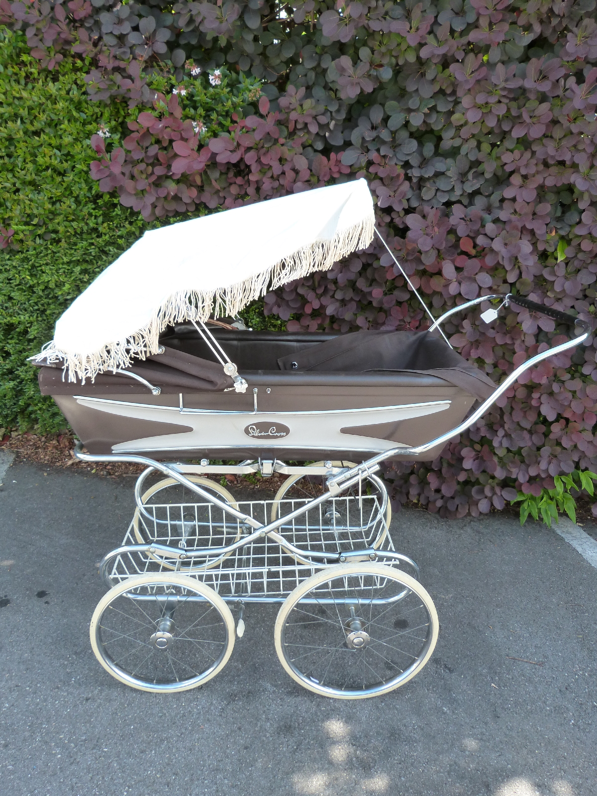 A Silver Cross pram with two tone brown body and Marlands pram canopy ...