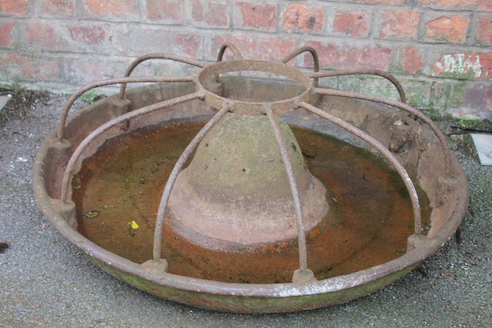 A late 19th century cast iron circular pig trough, 87cm diam