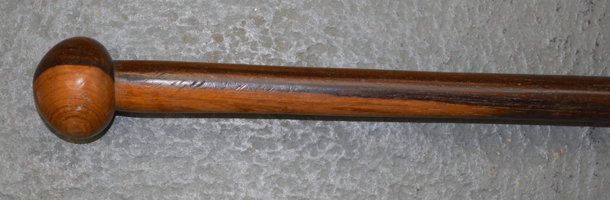 A CARVED WOODEN STAFF, of plain form. 158 cm long.