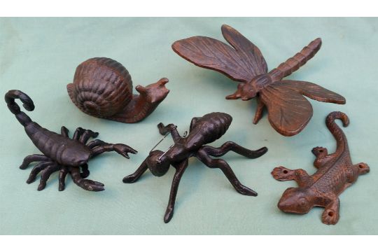A collection of cast iron insects