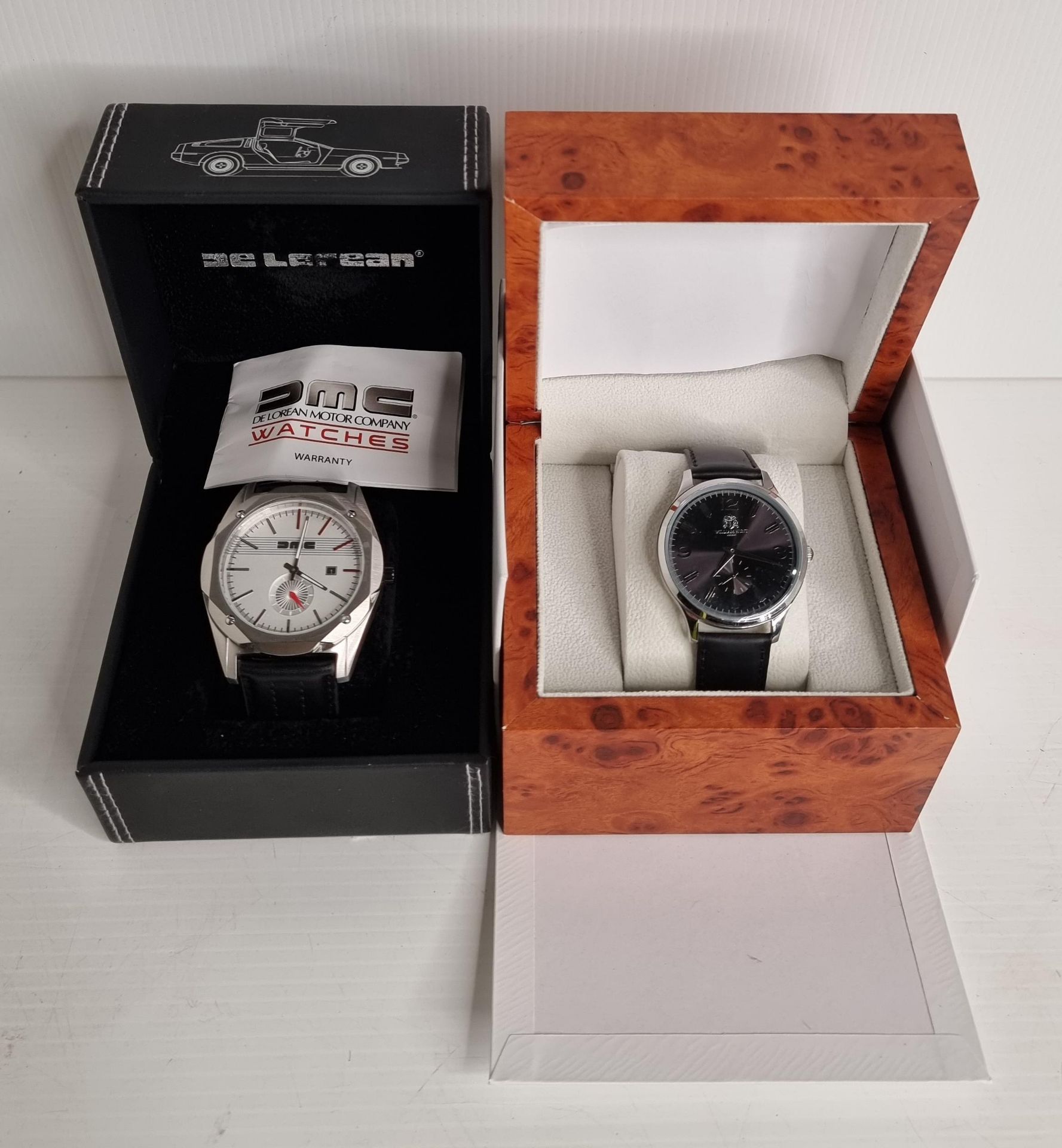 A DMC De Lorean Motor Company watch in case, and a William Hunt London ...