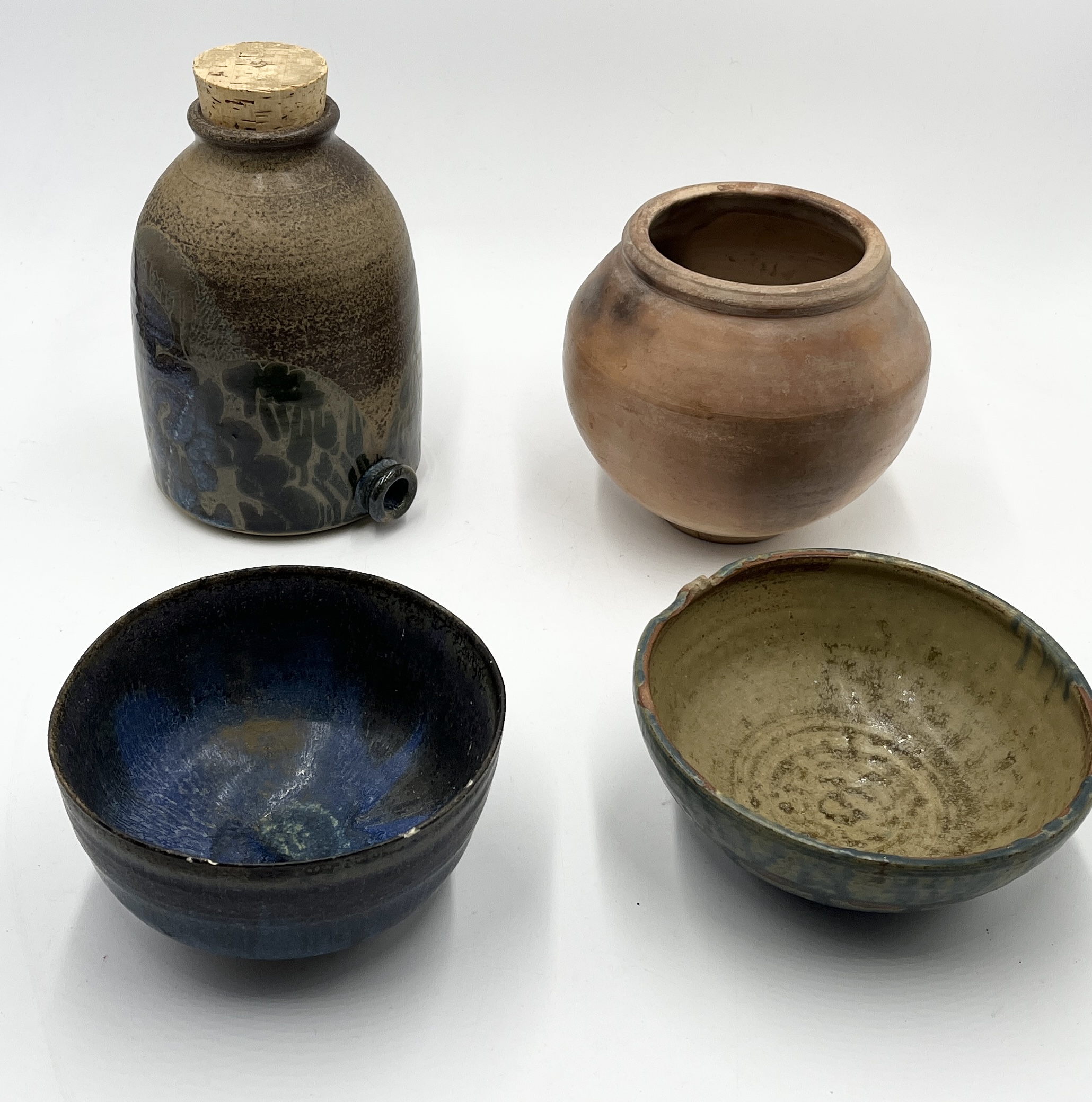 A group of four studio pottery pieces including Diana Worthy jar ...