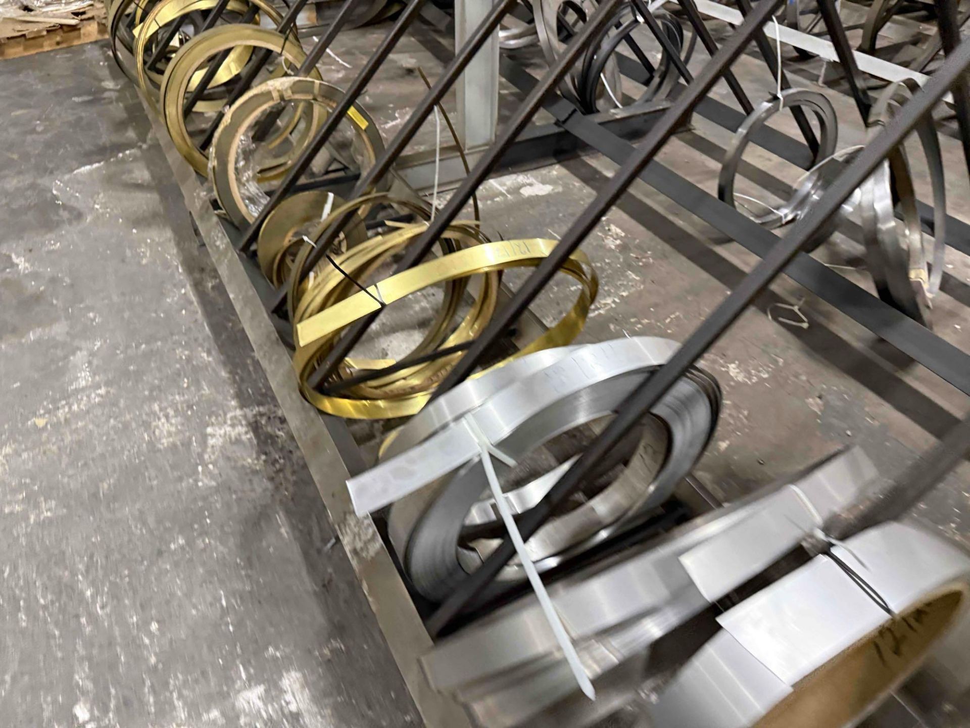 Metal Rack with Contents, Includes: Rolled Coil Steel and Brass