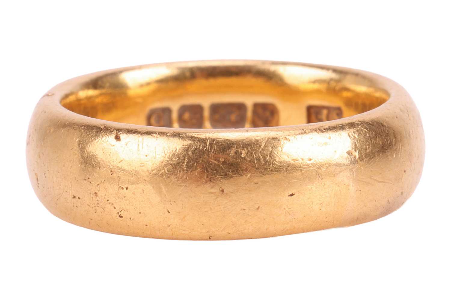 A 22ct court-style wedding band measuring 5.1 mm wide, size G, 7.2 ...