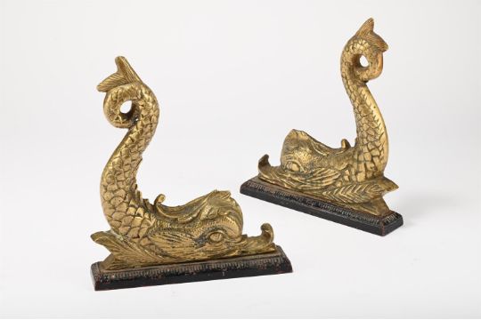 A PAIR OF VICTORIAN BRASS AND CAST IRON DOLPHIN DOOR STOPS OR DOOR ...
