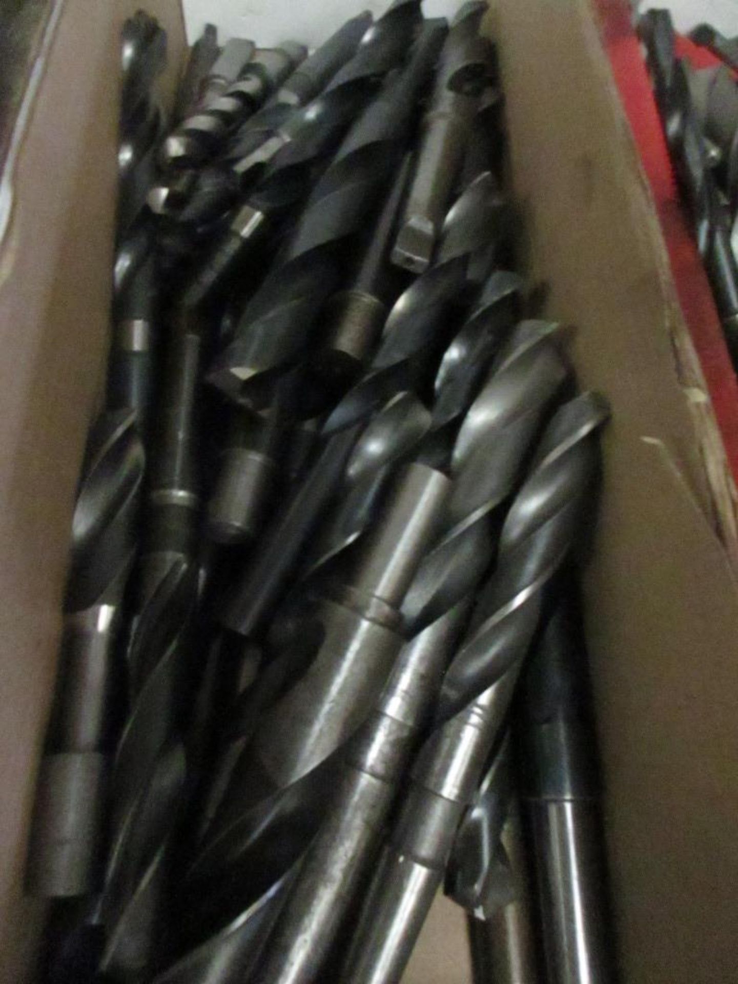 Tote box containing various drill bits