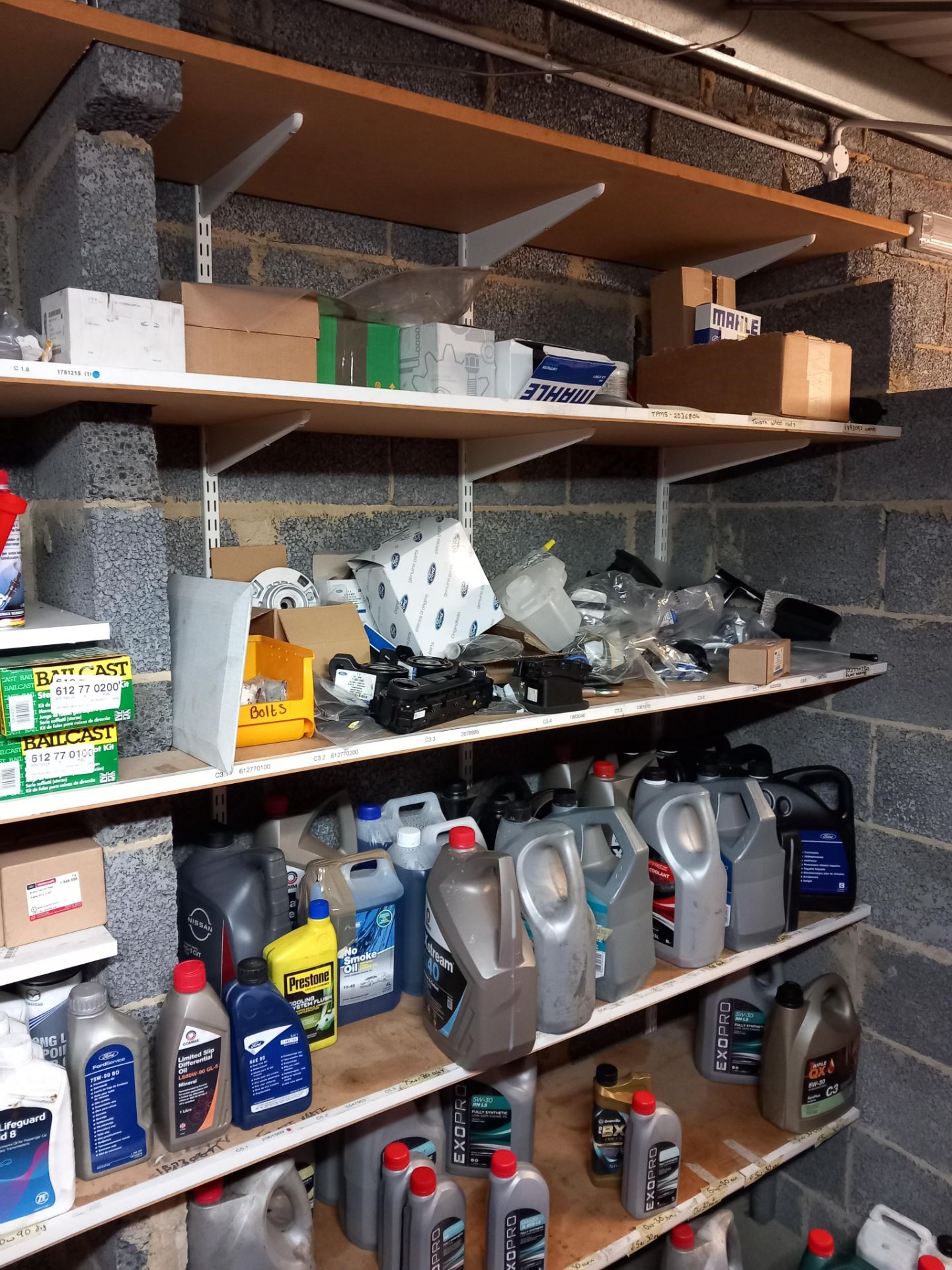 Contents of 'BIN C' rack containing various oils, puncture repair ...