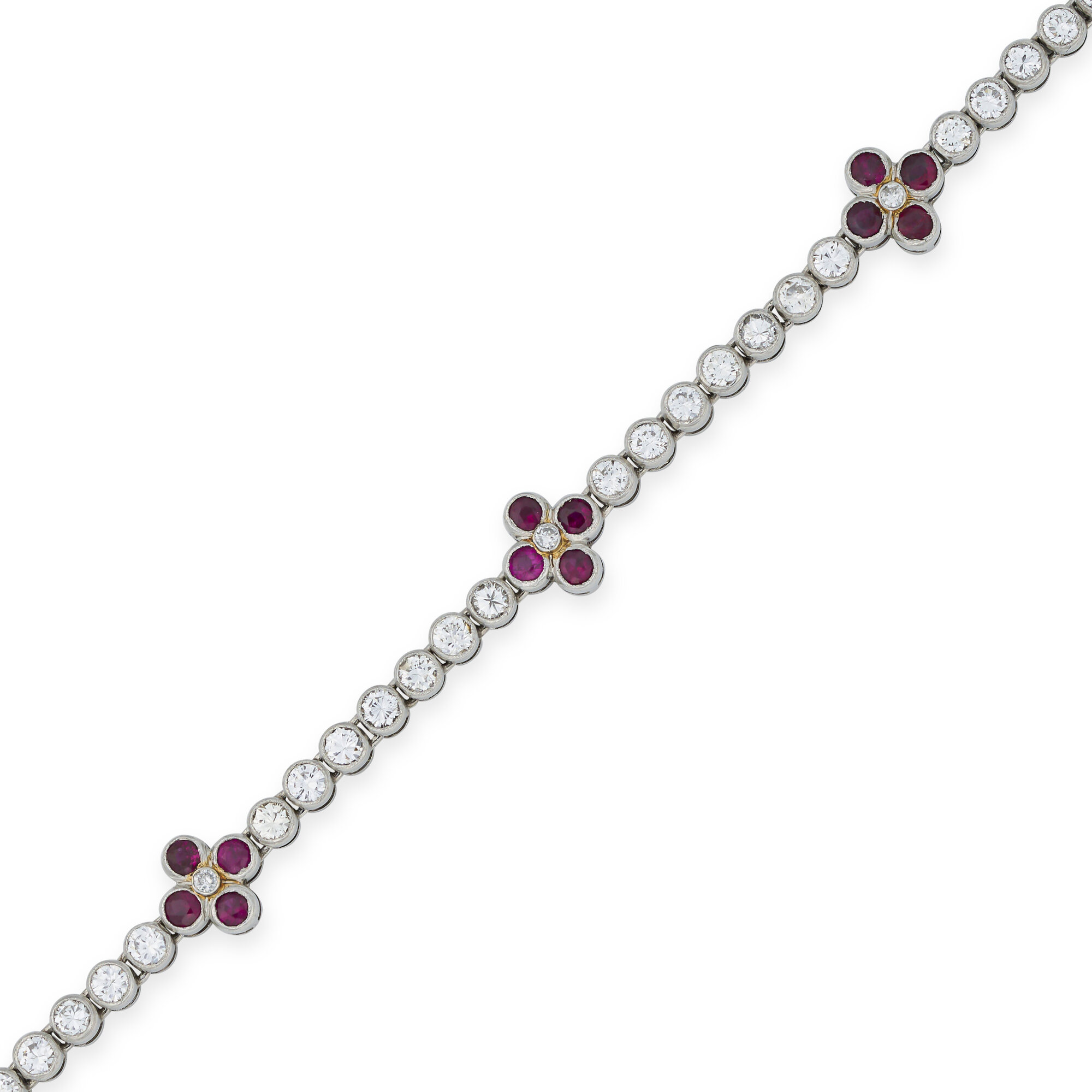 NO RESERVE - A RUBY AND DIAMOND BRACELET comprising a row of round ...