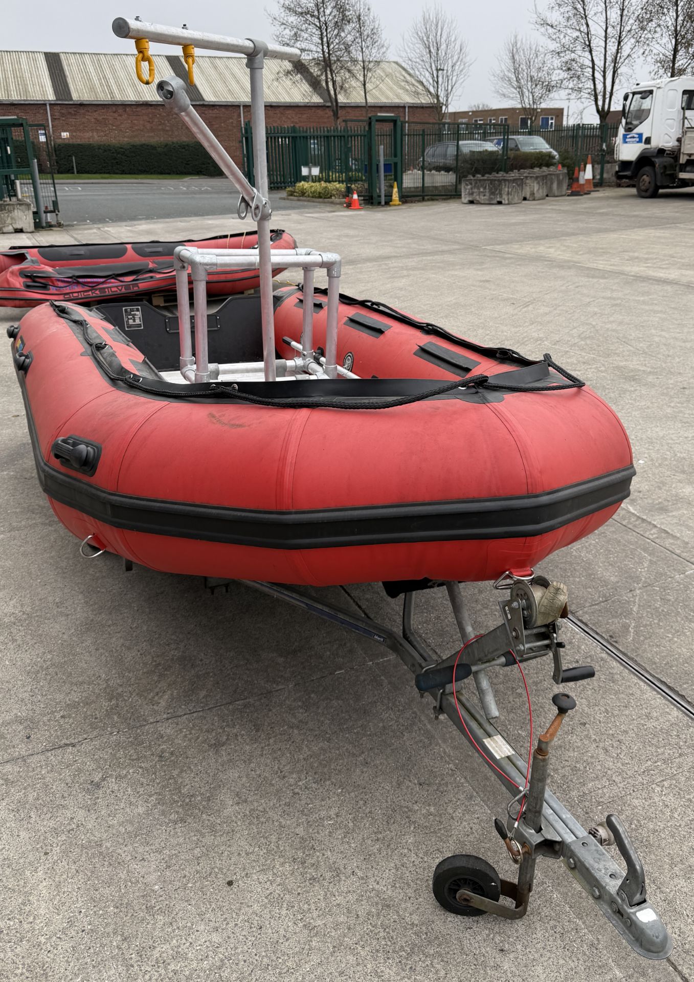 A Boatworld 420 Pro nine person 3.6 rib in red, 4.2m long, mounted on a ...
