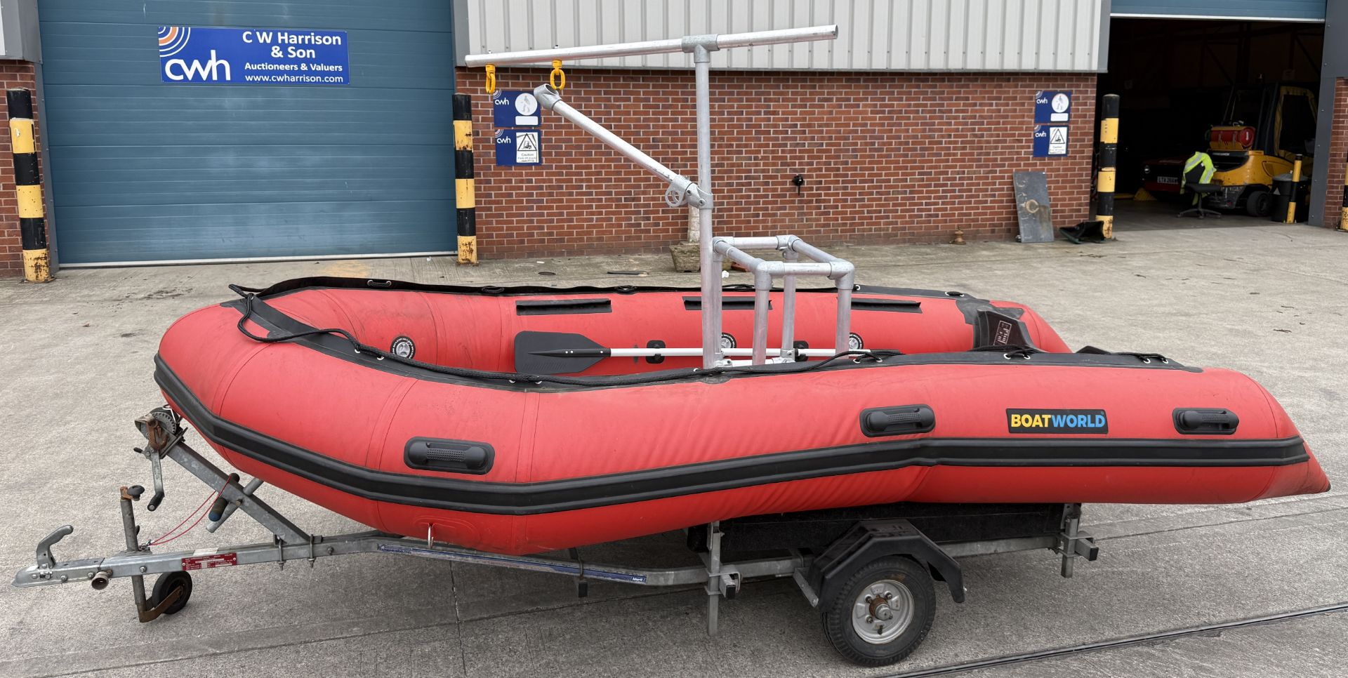 A Boatworld 420 Pro nine person 3.6 rib in red, 4.2m long, mounted on a ...