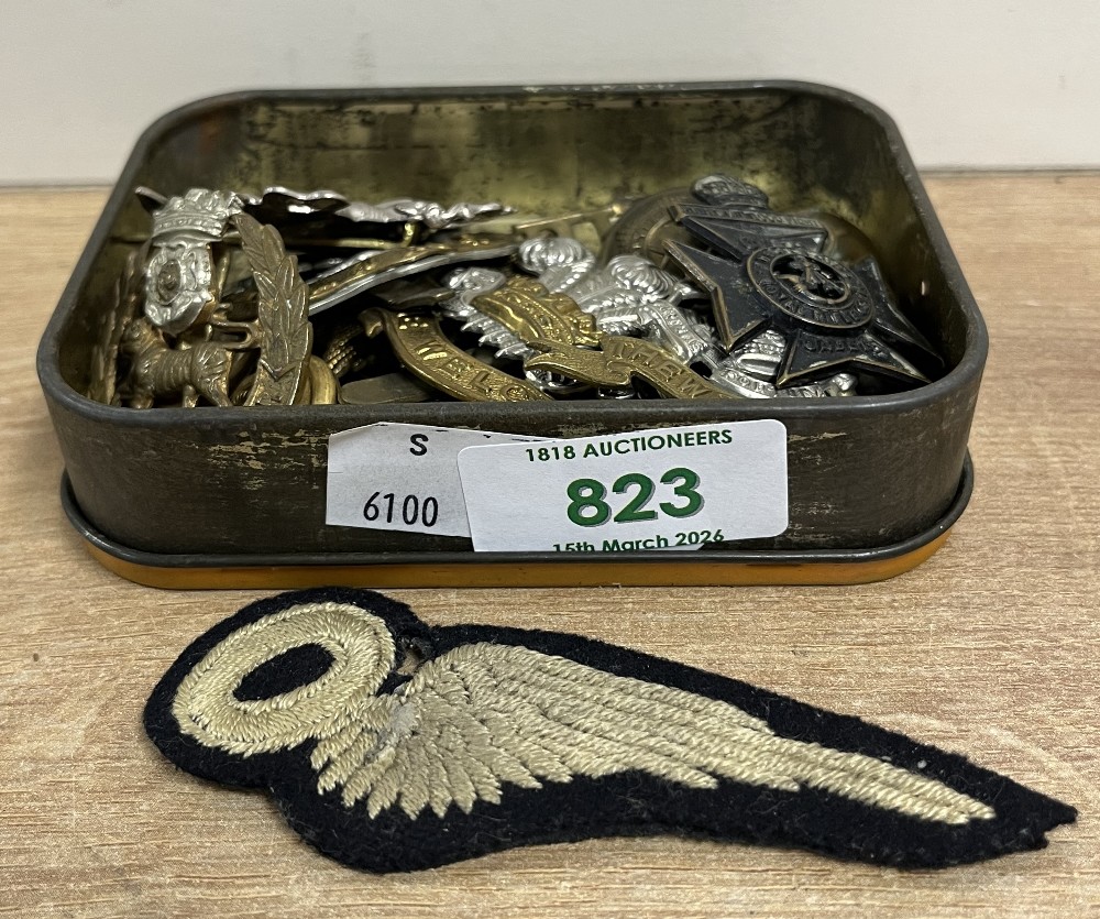 Military badges, buttons, shoulder titles comprising a WW1 metal wound ...