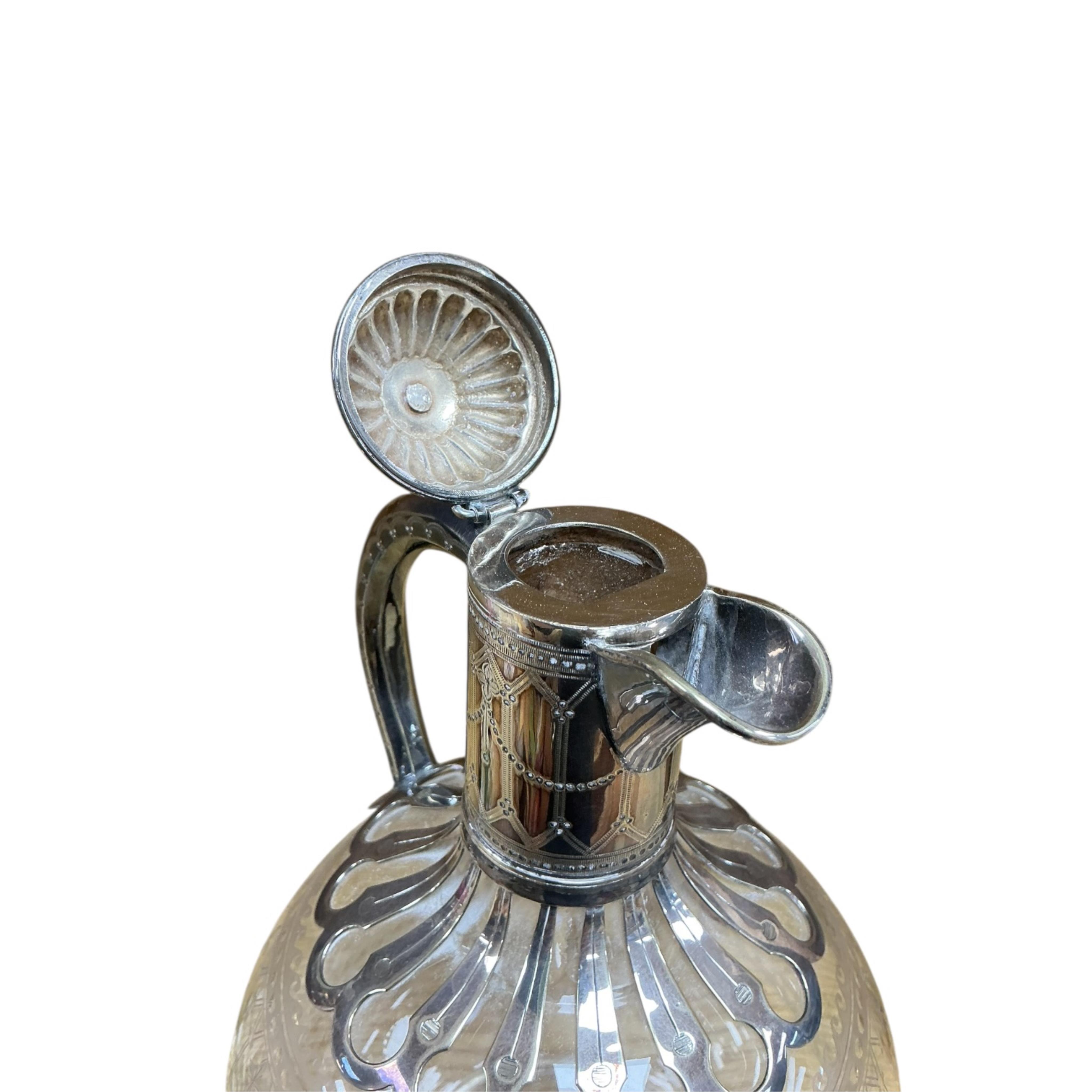 A Victorian silver plate mounted etched glass claret jug, height 22cm.