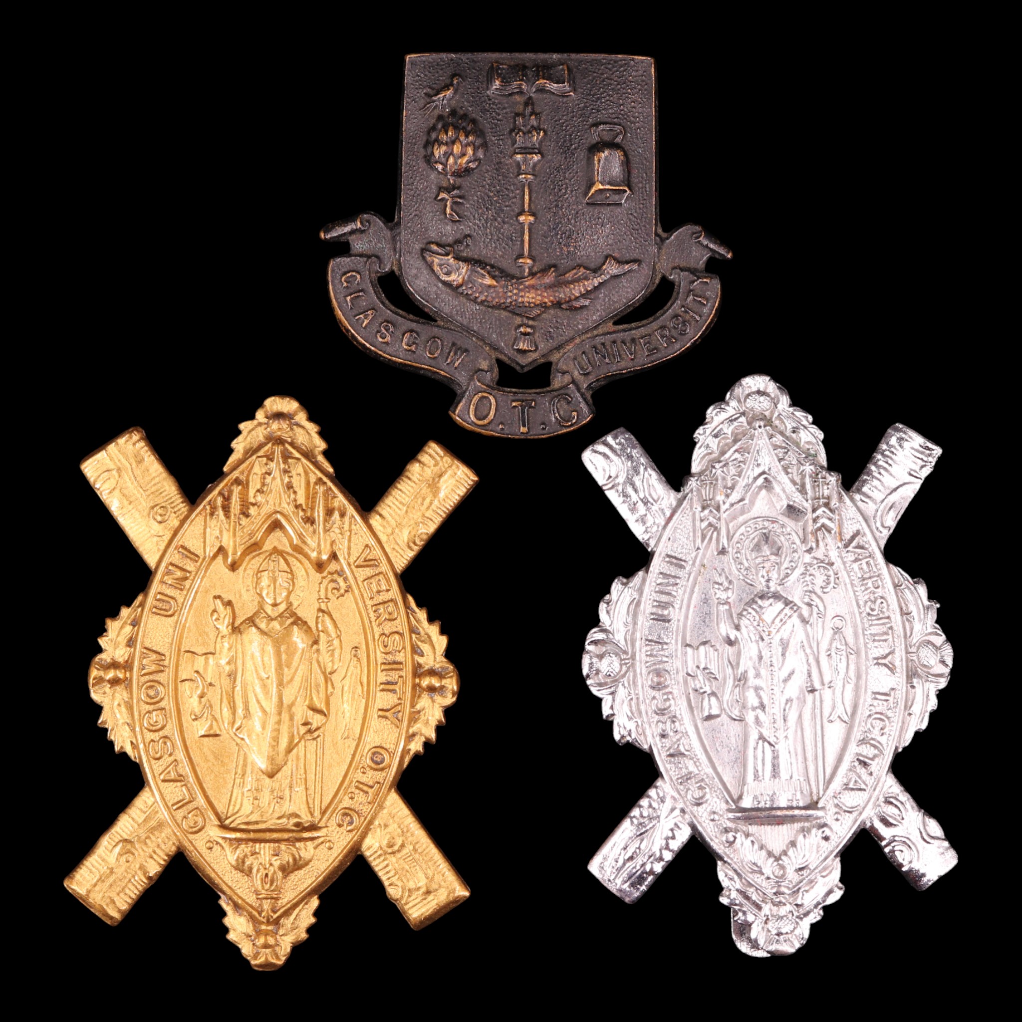 Three Glasgow University OTC glengarry badges, largest 5.7 cm x 4 cm
