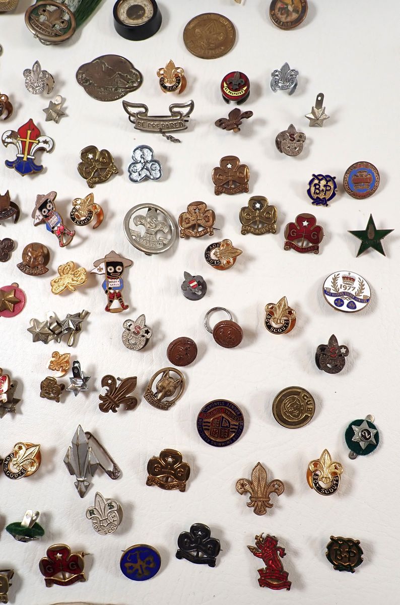 A collection of metal Boy Scouts and Girl Guides badges, many enamelled ...