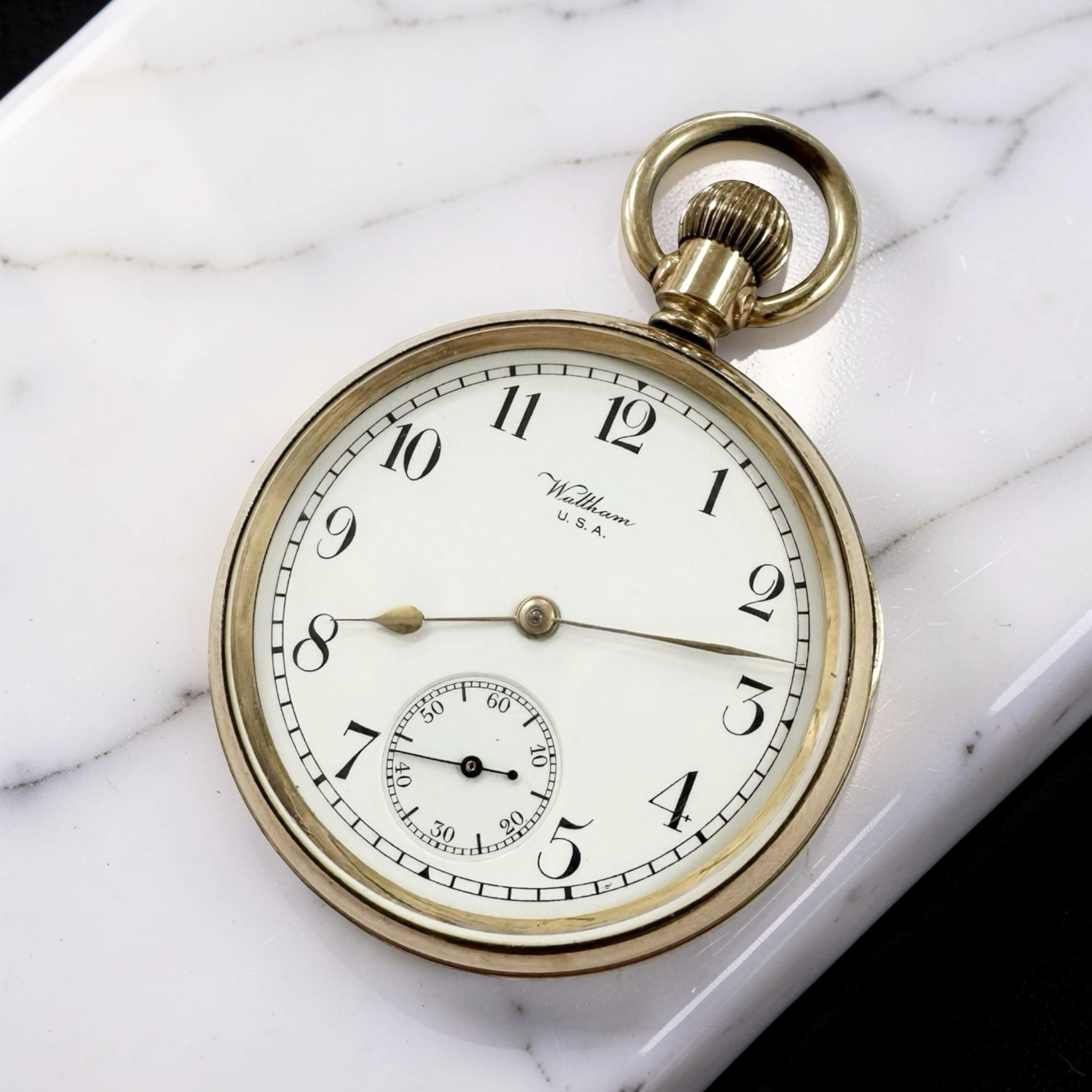 A Waltham USA Traveller gold-plated open face pocket watch, movement ...