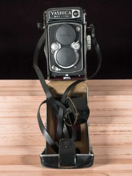 A Yashica-Mat-124 TLR film camera in leather case.