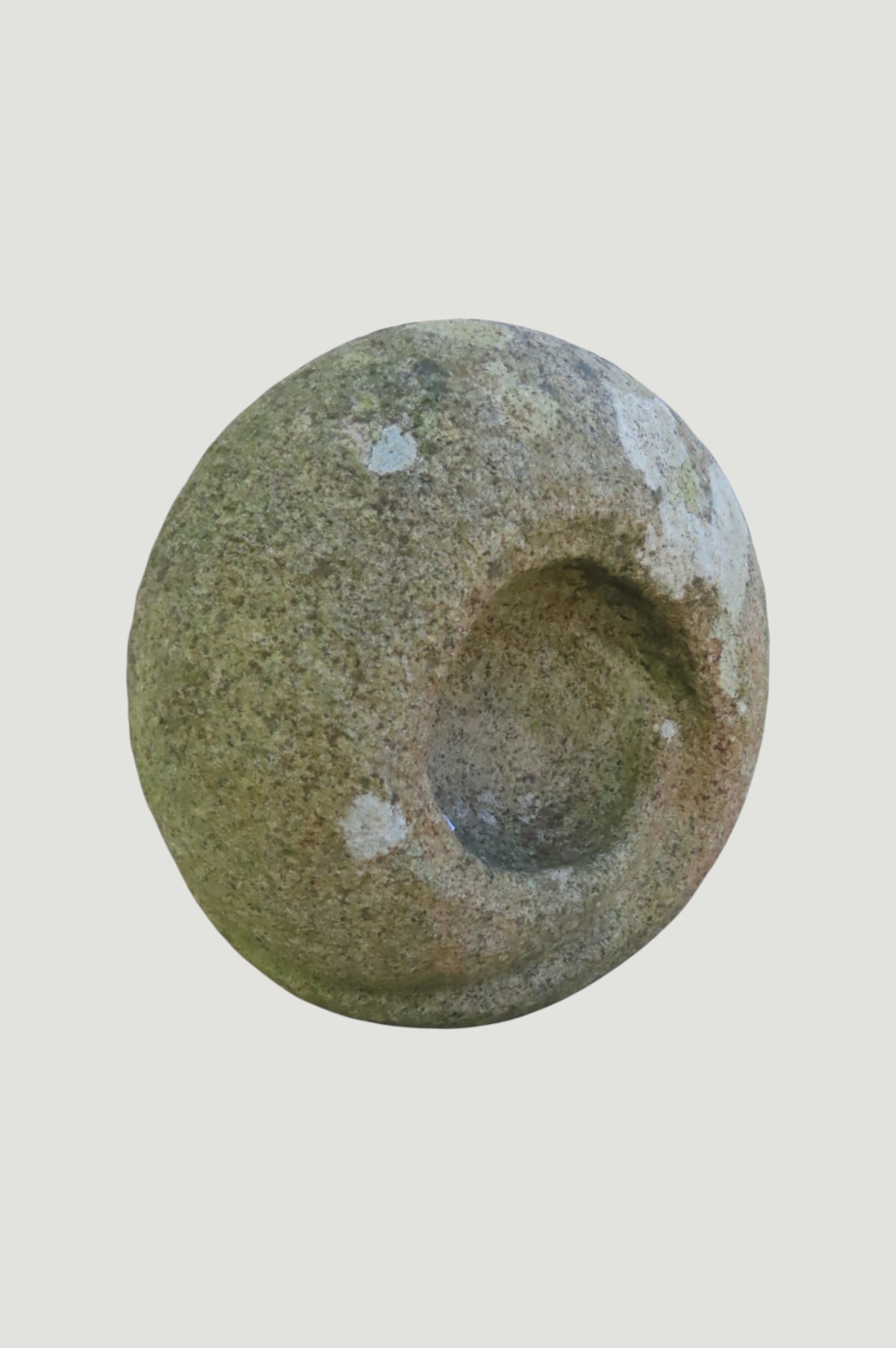 A small weathered carved granite dished circular contemporary garden ...