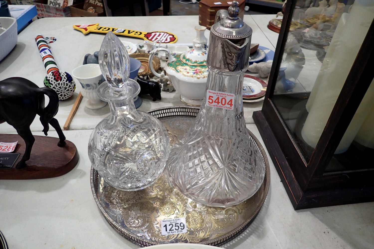 Plated galleried tray with a silver plated claret jug and crystal ...