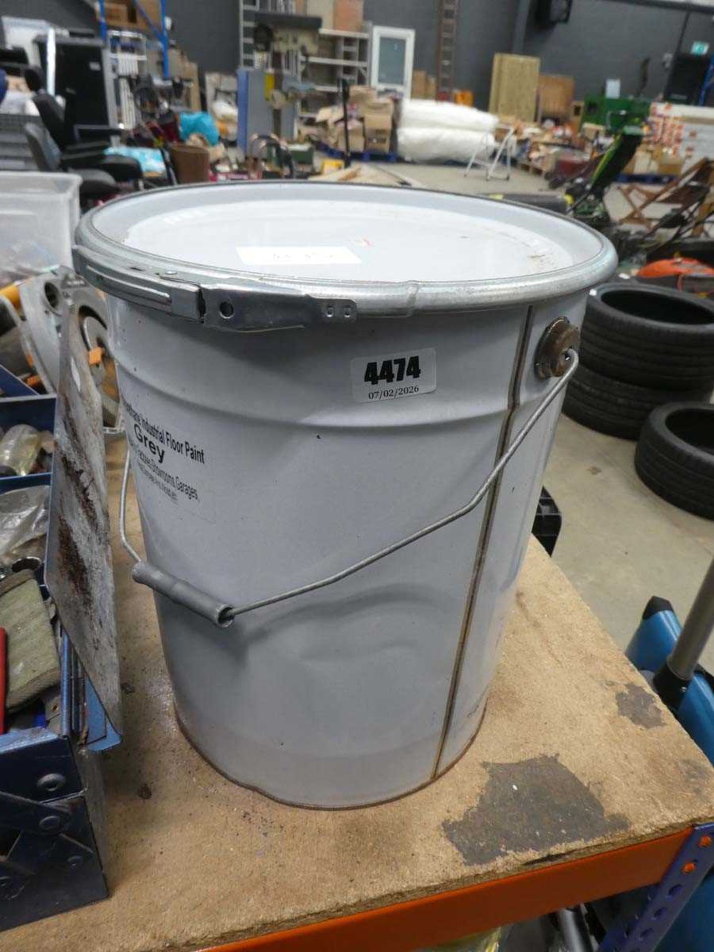 Tub of polyurethane industrial floor paint in grey