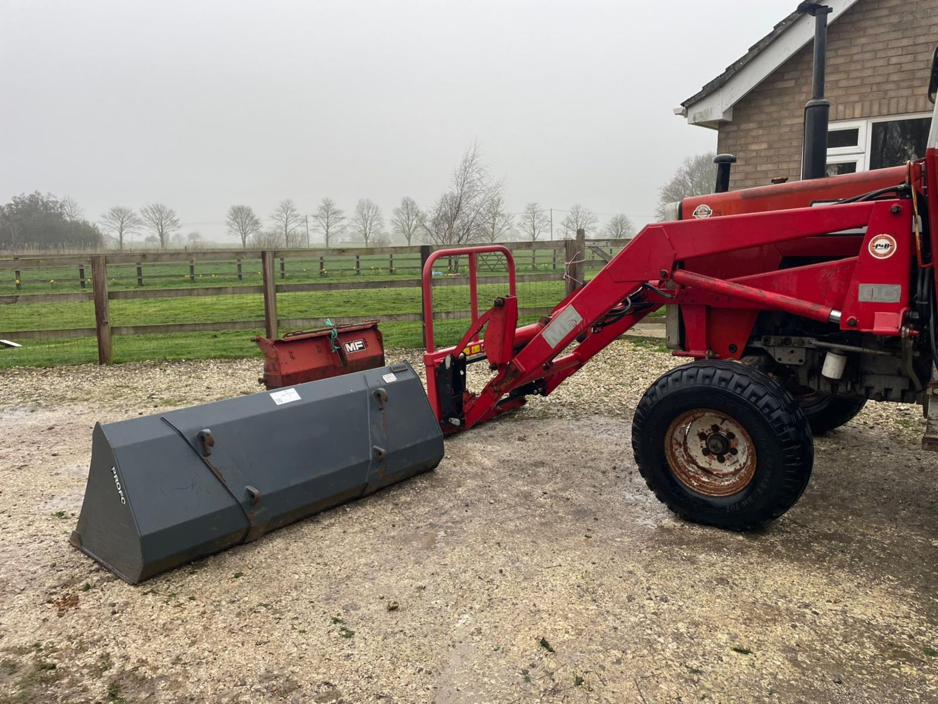 Massey Ferguson 575 with attachments: Euro 8 headstock, loader bucket ...