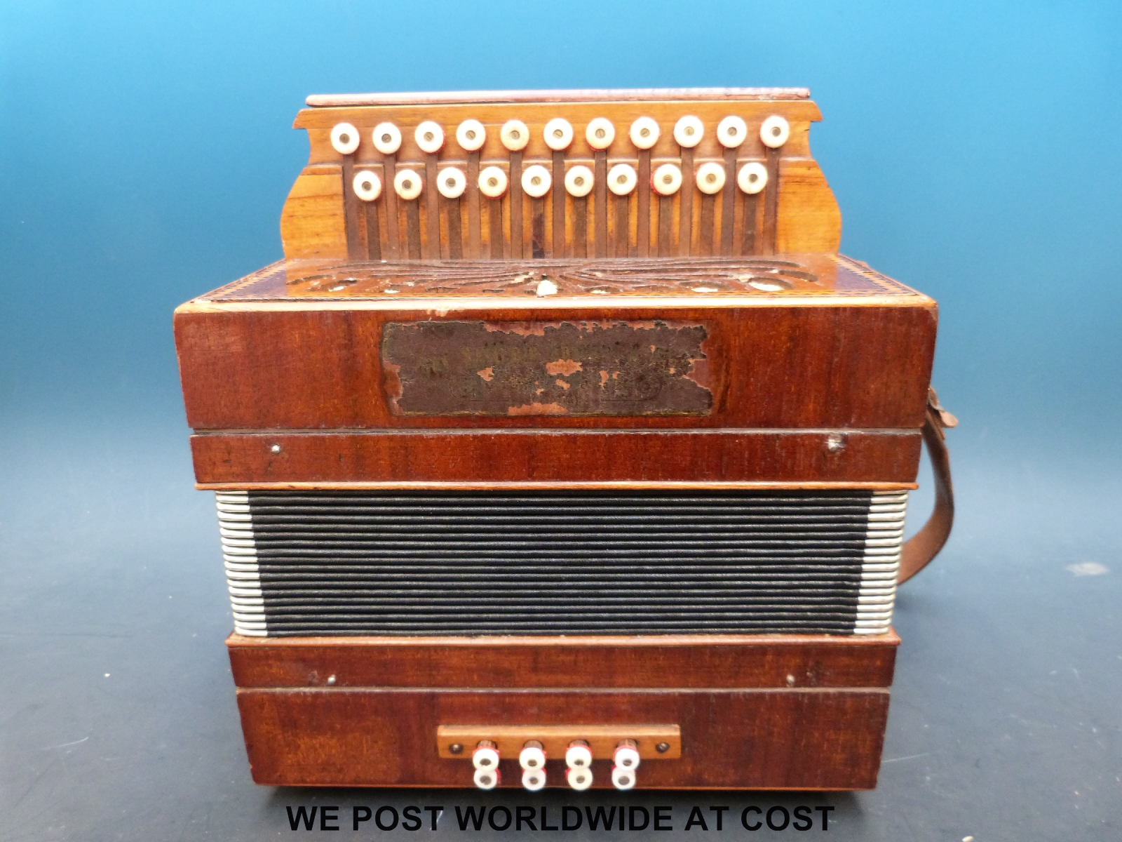 A two row melodeon in DG, thought to be Italian in wooden finish inlaid ...