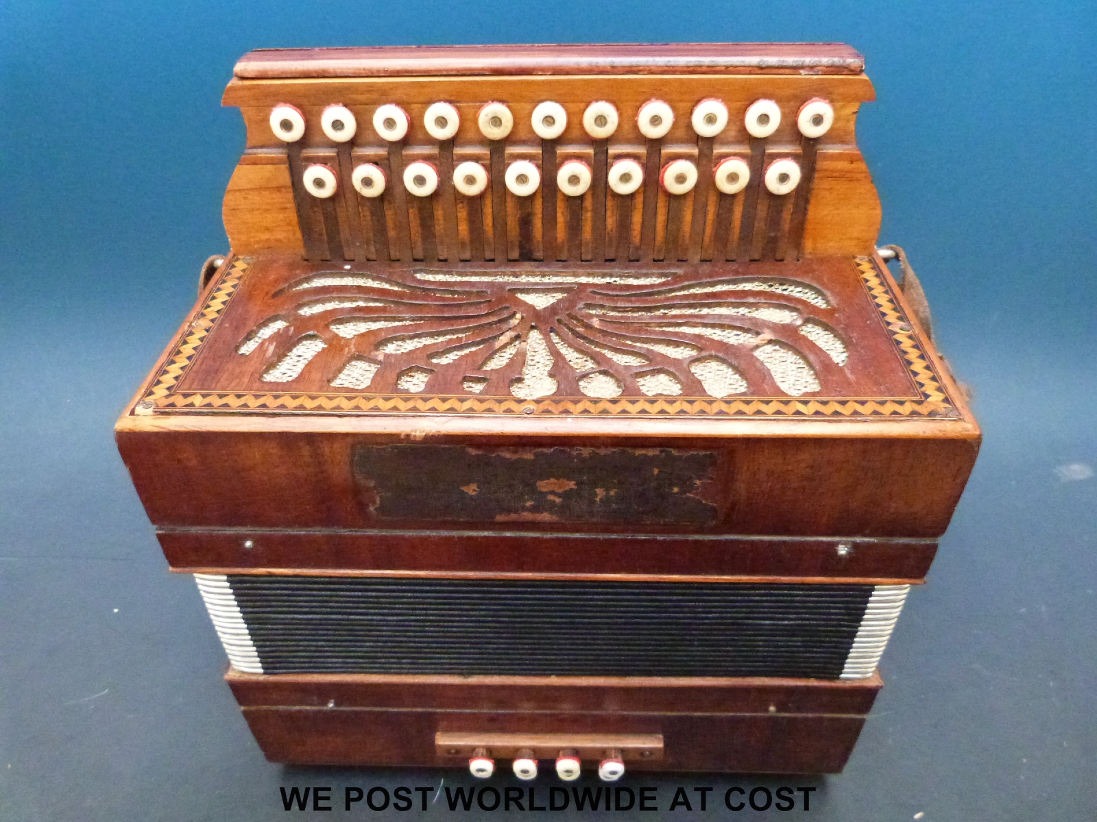 A two row melodeon in DG, thought to be Italian in wooden finish inlaid ...