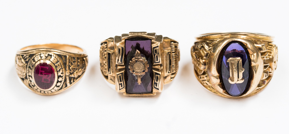 Three Jostens American college rings, set coloured paste for Lawrence ...