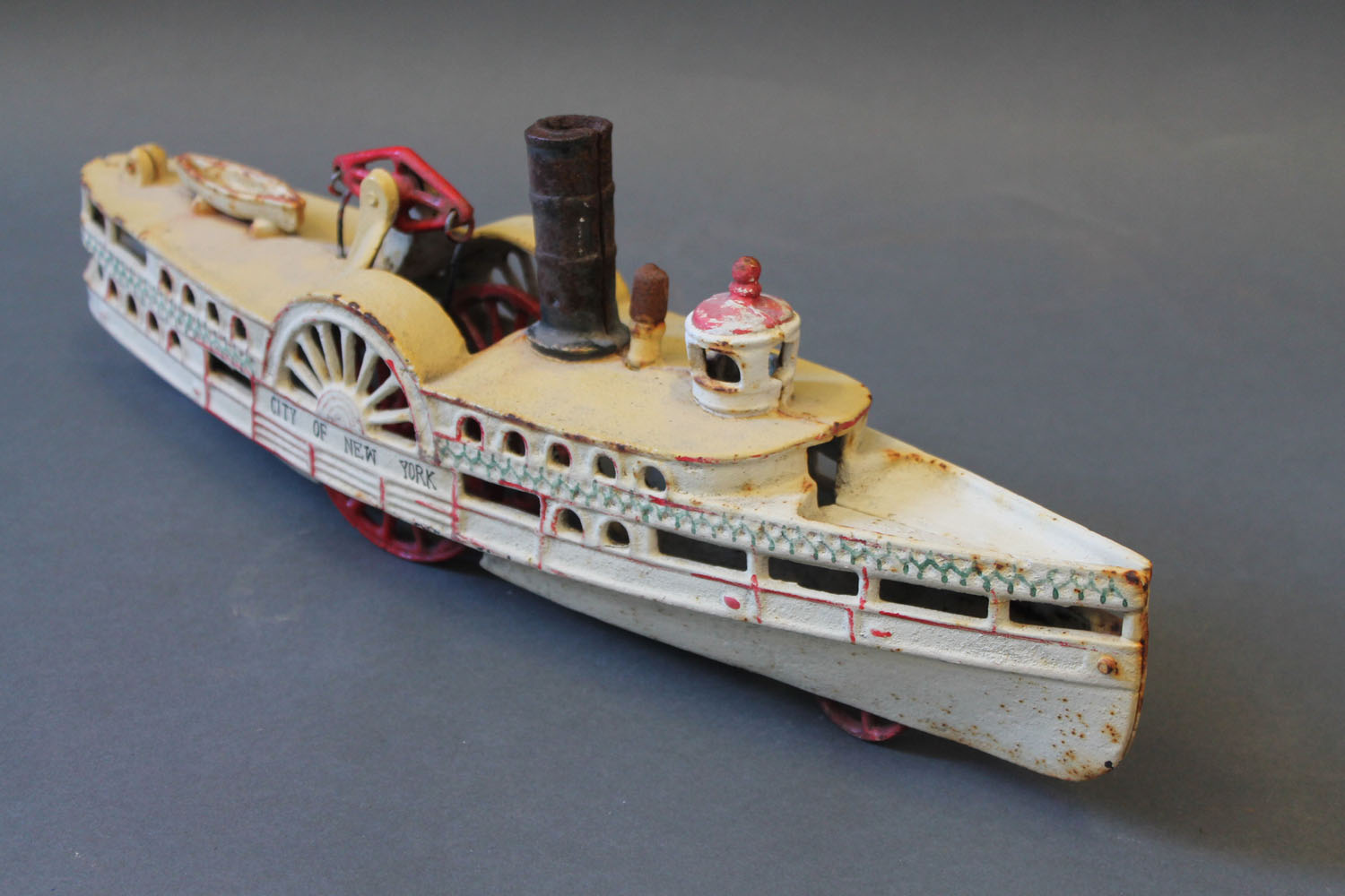 An American cast iron paddle steamer toy, circa 1903, possibly by ...