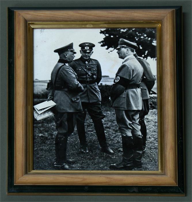 A glazed and framed picture of Adolf Hitler with other German officers ...