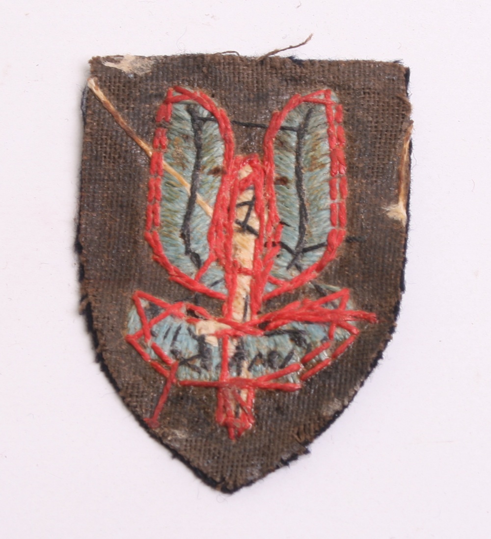 Scarce Late WW2 SAS (Special Air Service) Beret Badge being embroidered ...
