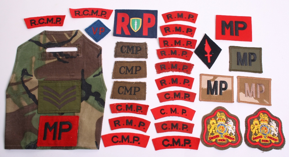 Grouping of Royal Military Police Insignia, consisting of embroidered ...